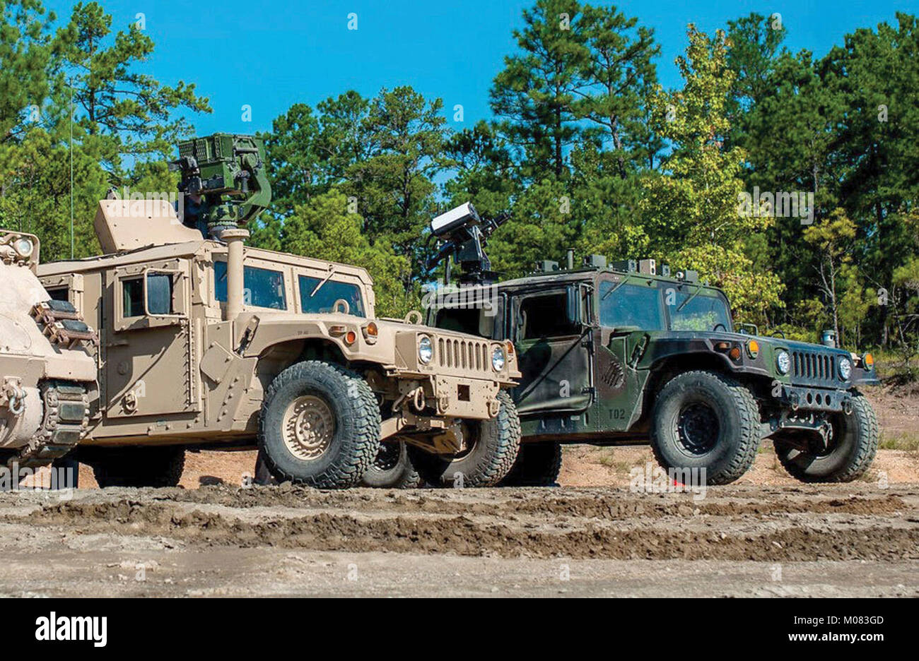 From left, the Wingman command-and-control vehicle and the unmanned ...
