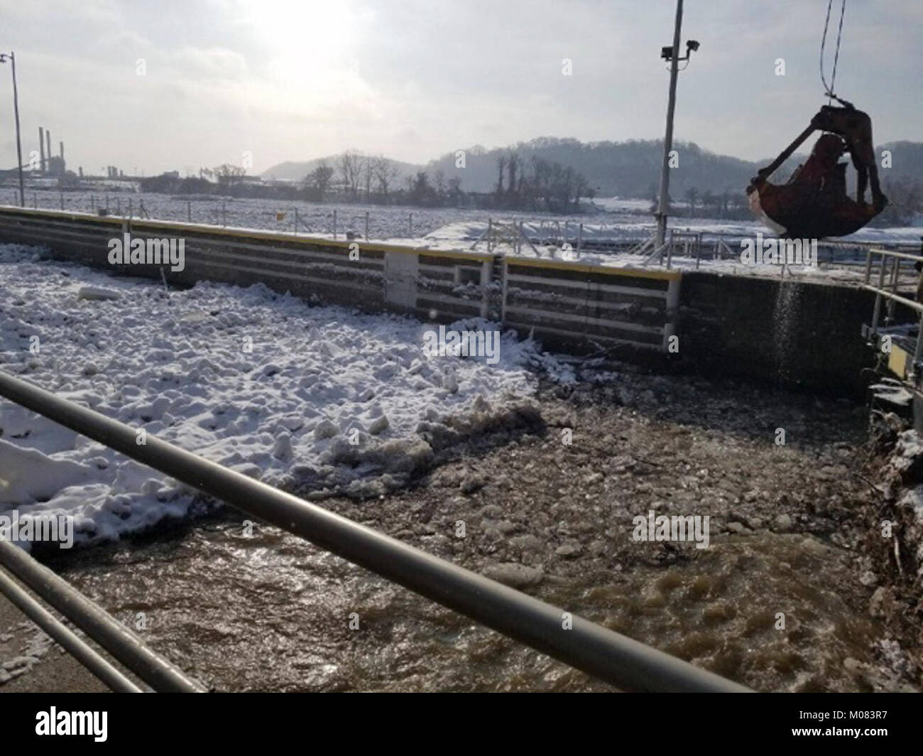 U.S. Army Corps of Engineers members conduct ice-breaking operations at ...