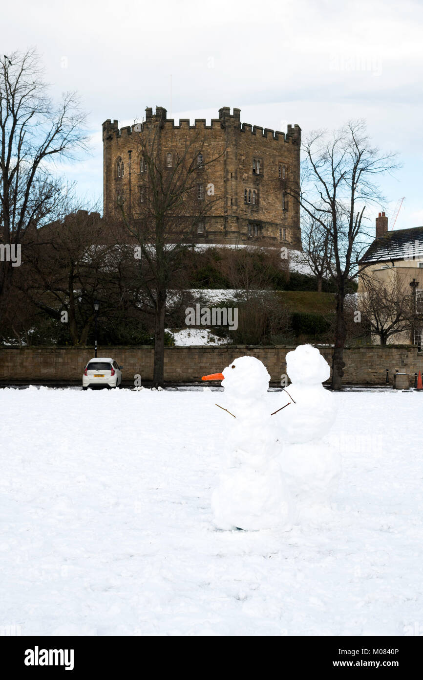 Two snowmen on Palace Green in front Durham castle keep, Durham City ...