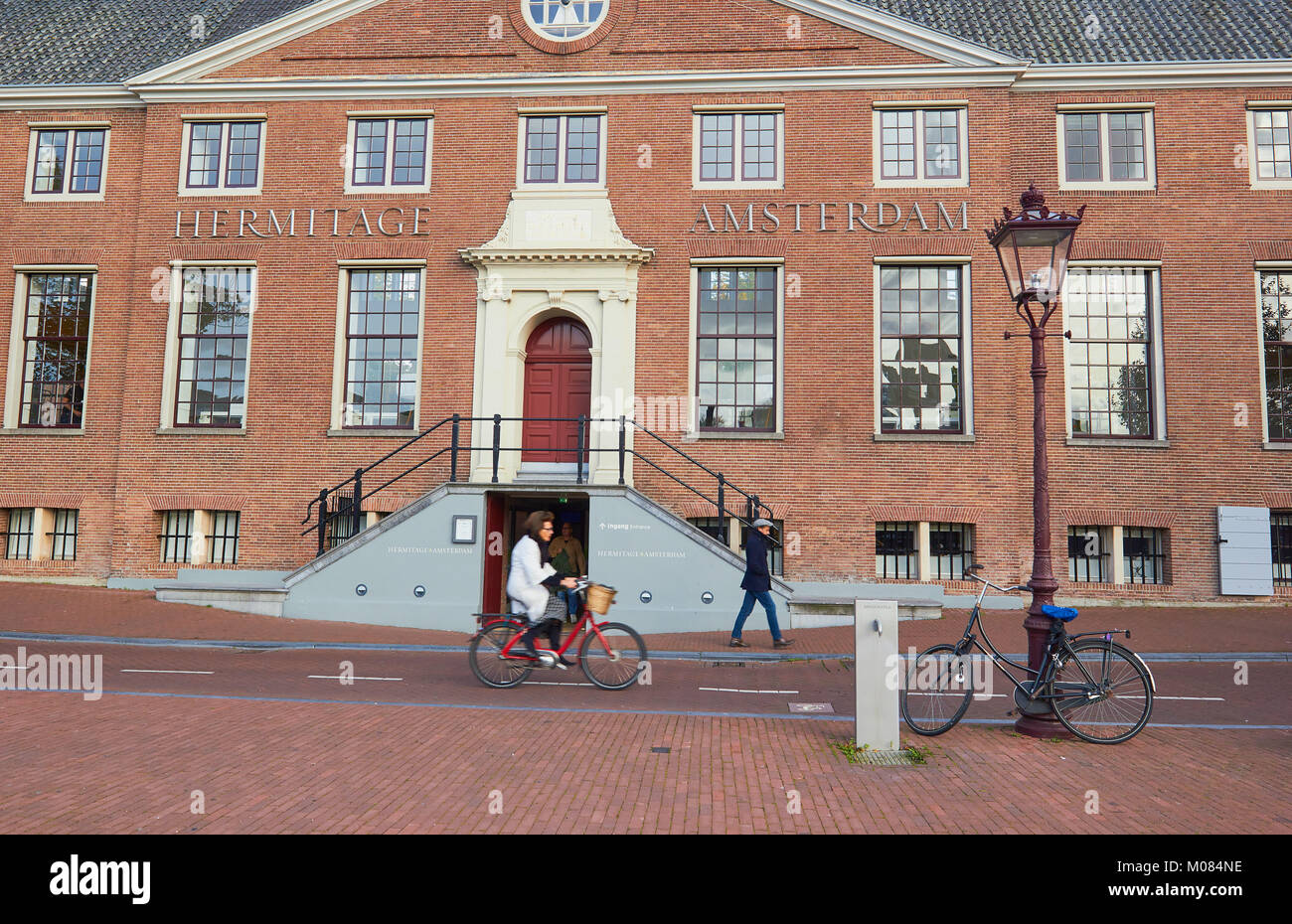 Cyclist passing the Hermitage Museum, Amsterdam, Netherlands, Located ...