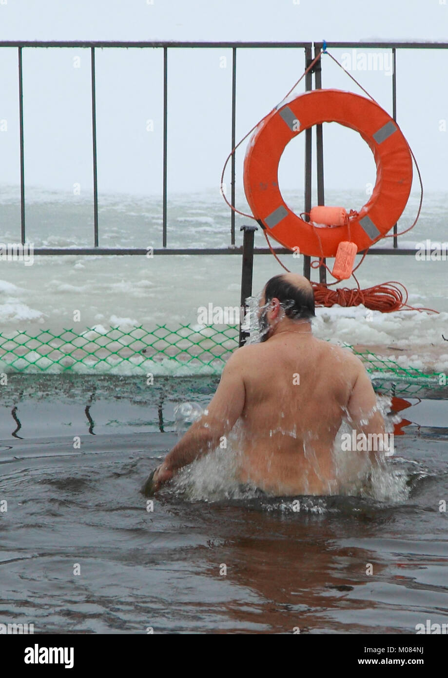 Epiphany in Russia. Male wanting to imitate Jesus Christ, three times ...
