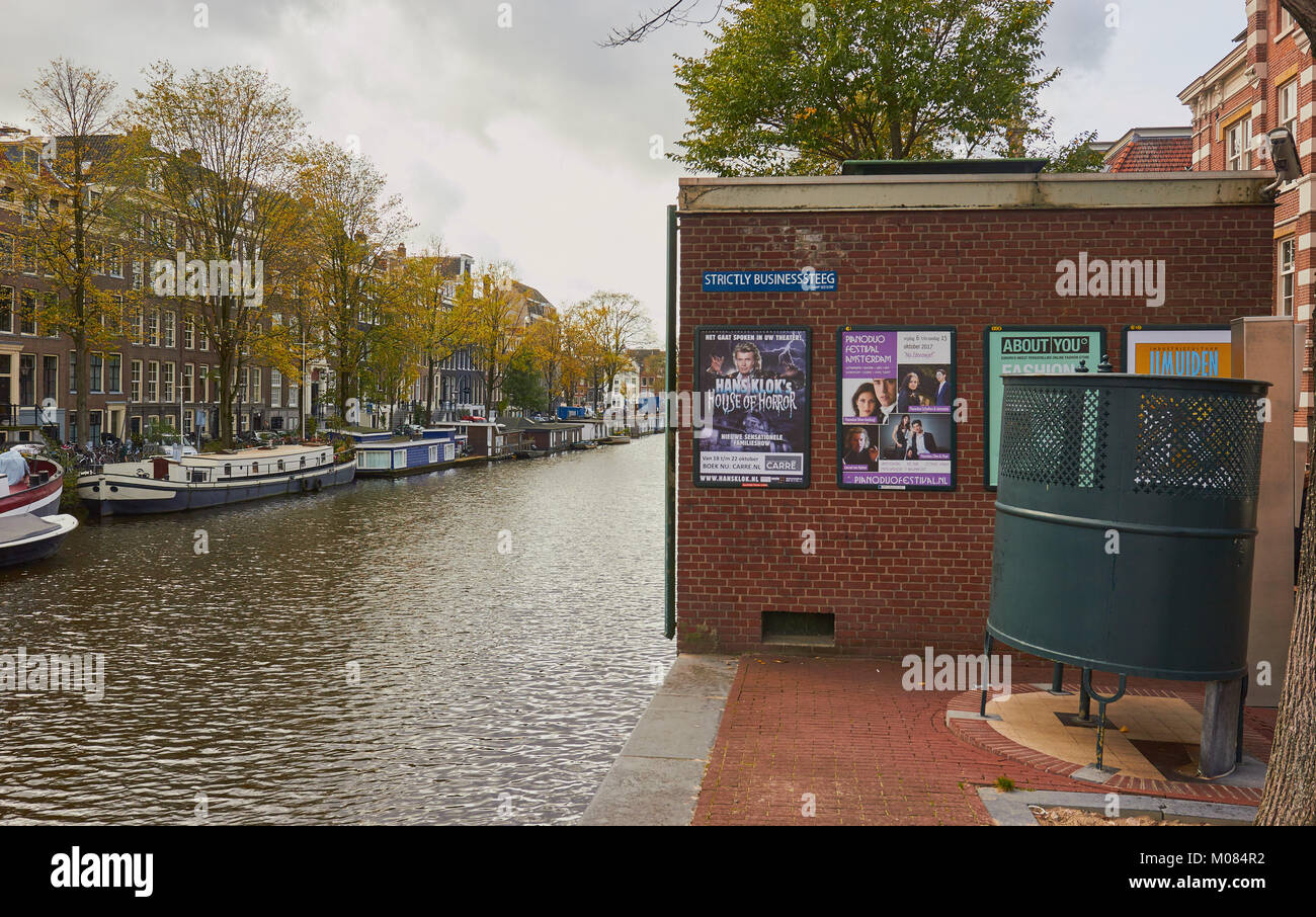 Original street urinal, pissoir next to canal, Amsterdam, Holland Stock ...