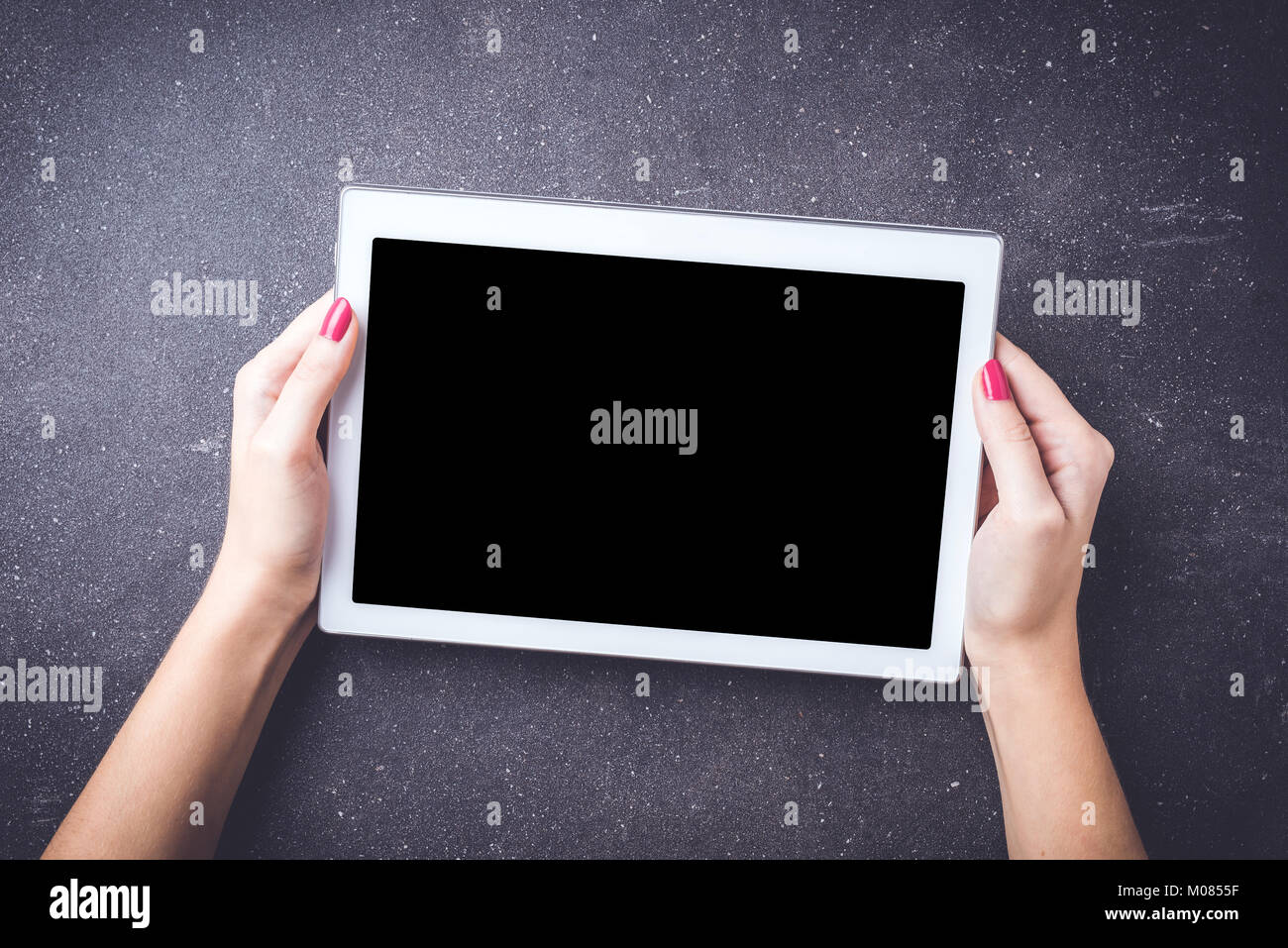 Holding black tablet woman hi-res stock photography and images - Alamy