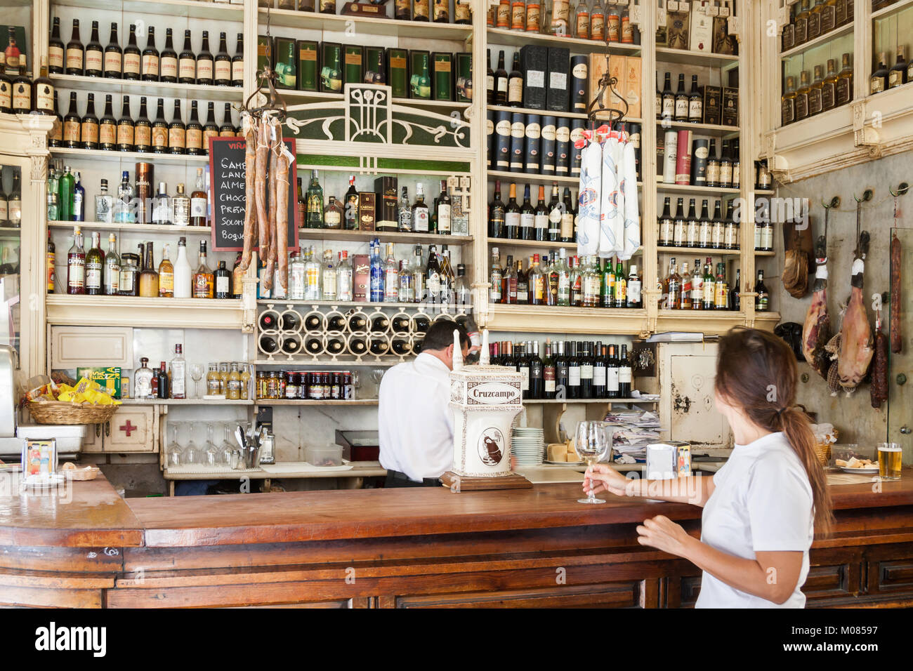 Woman at bar in the famous El Rinconcillo tapas bar in Seville, Spain ...