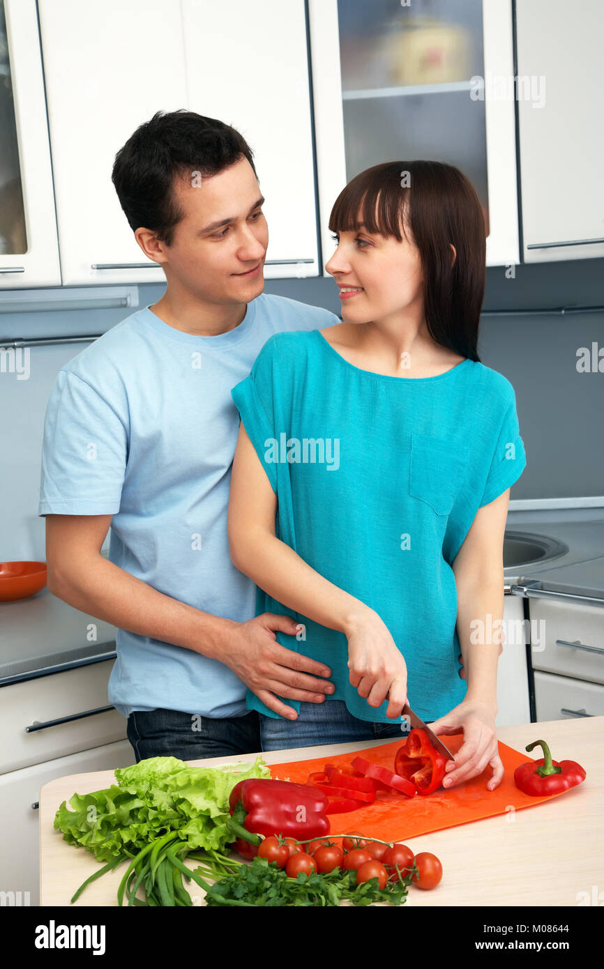 couple cooking together in the kitchen Stock Photo - Alamy