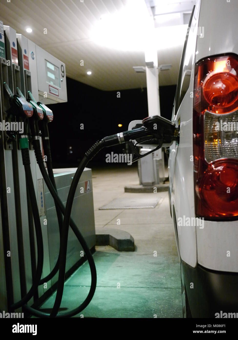 someone filling up car with fuel for driving Stock Photo - Alamy