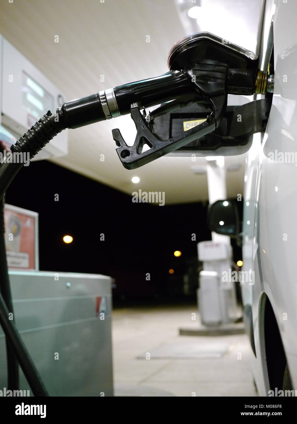 someone filling up car with fuel for driving Stock Photo - Alamy