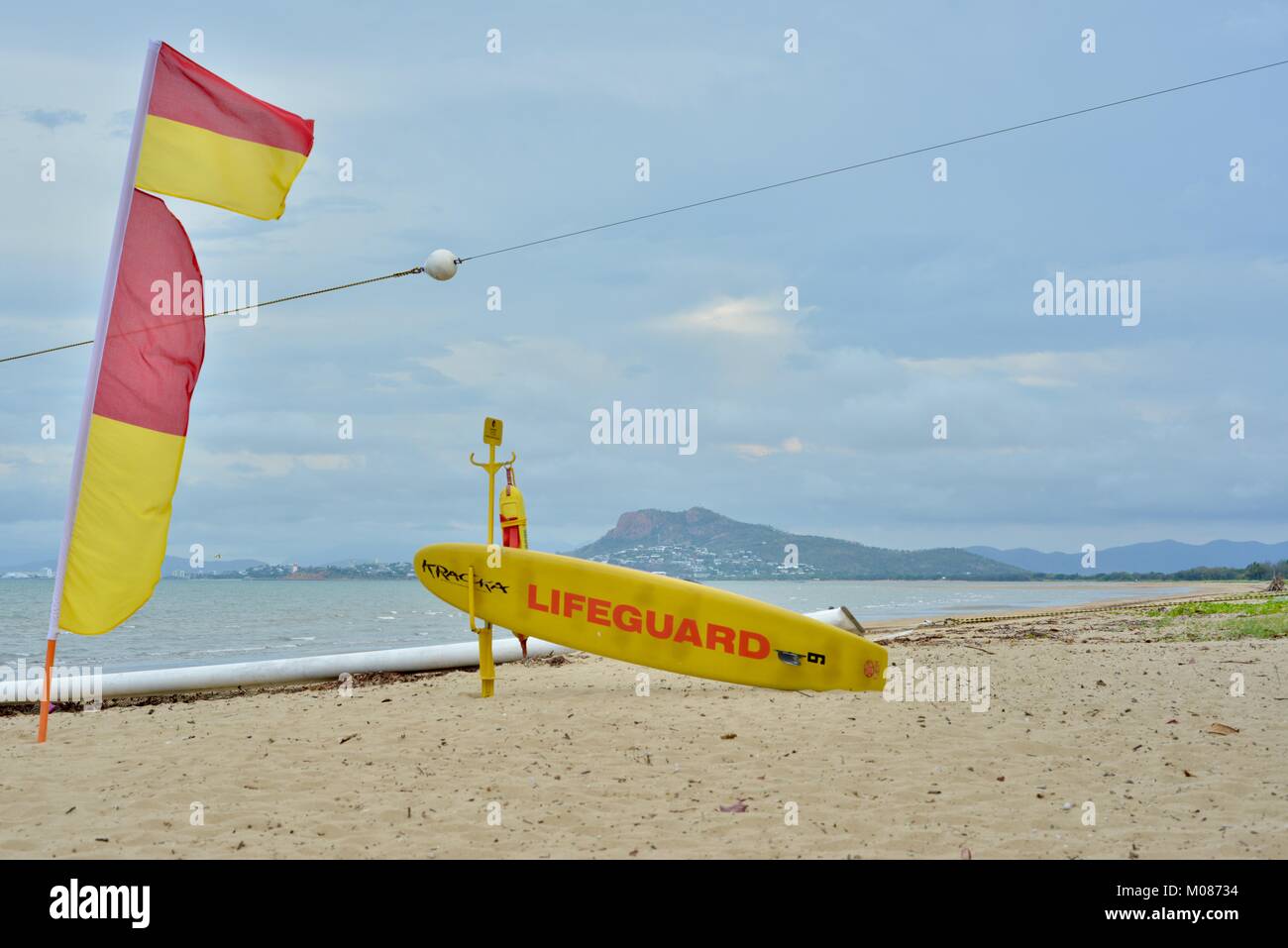 Surf life saving flags and paddle board at a stinger net, Pallarenda ...