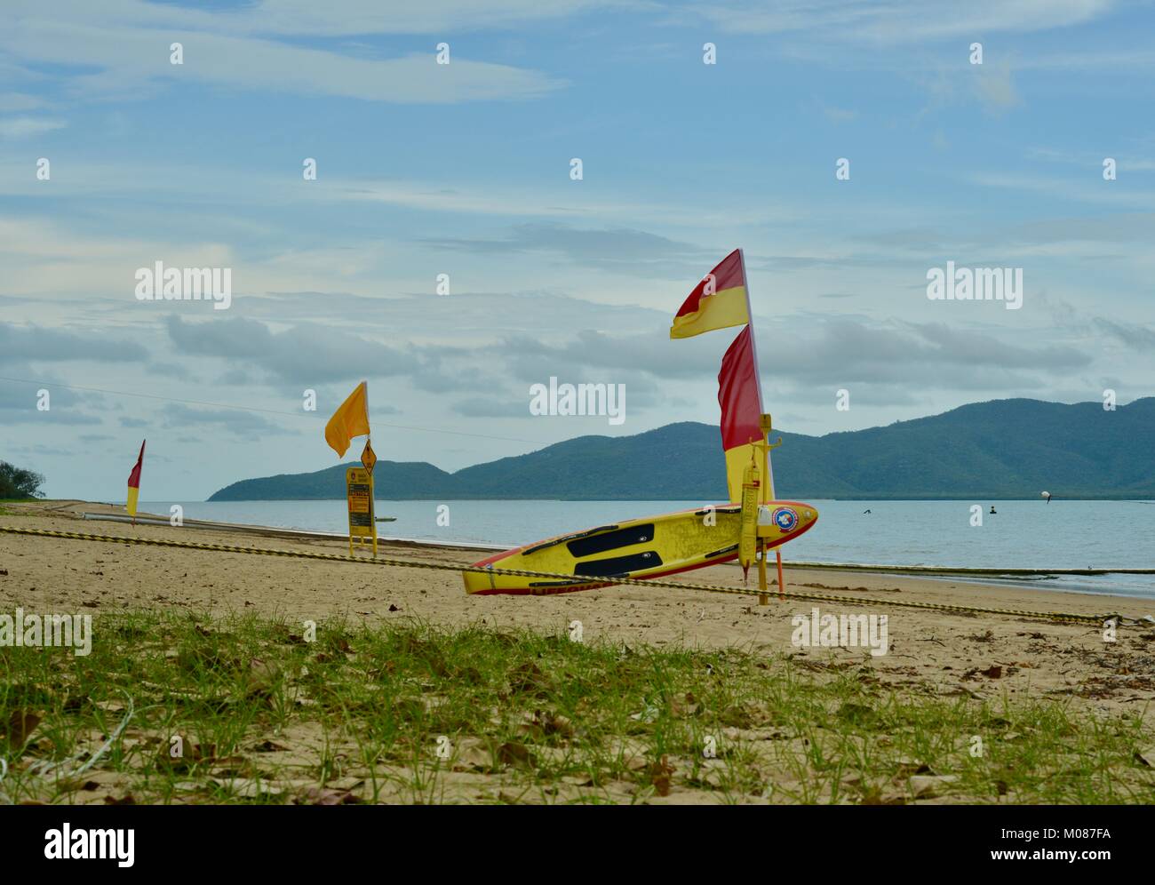 Surf life saving flags and paddle board at a stinger net, Pallarenda ...