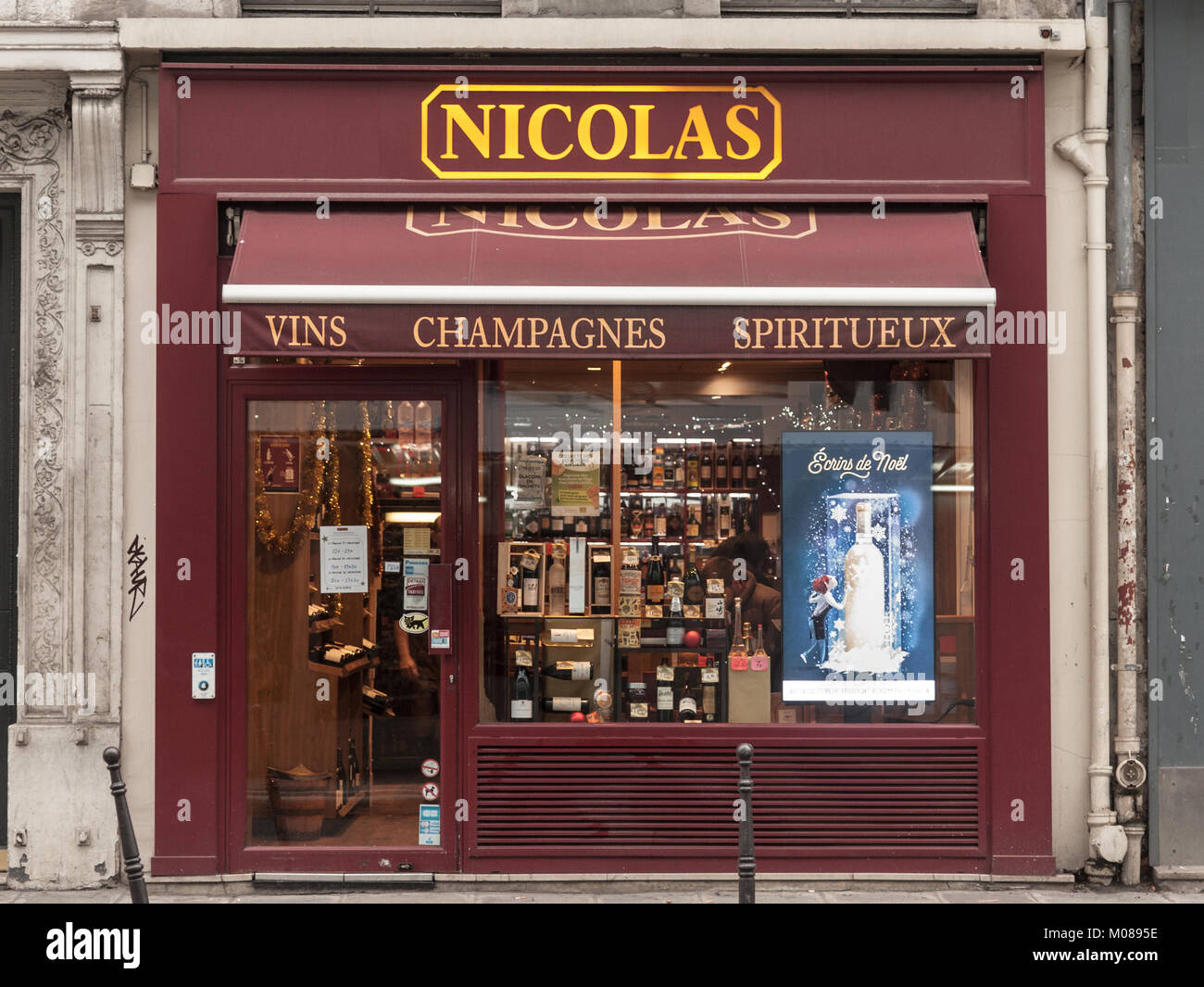 PARIS, FRANCE - DECEMBER 20, 2017: Nicolas logo on their shop on Rue de ...