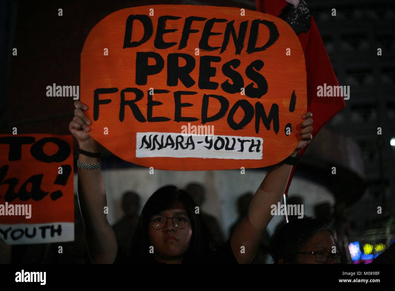 Manila, Philippines. 19th January, 2018. An activist holds a placard as ...