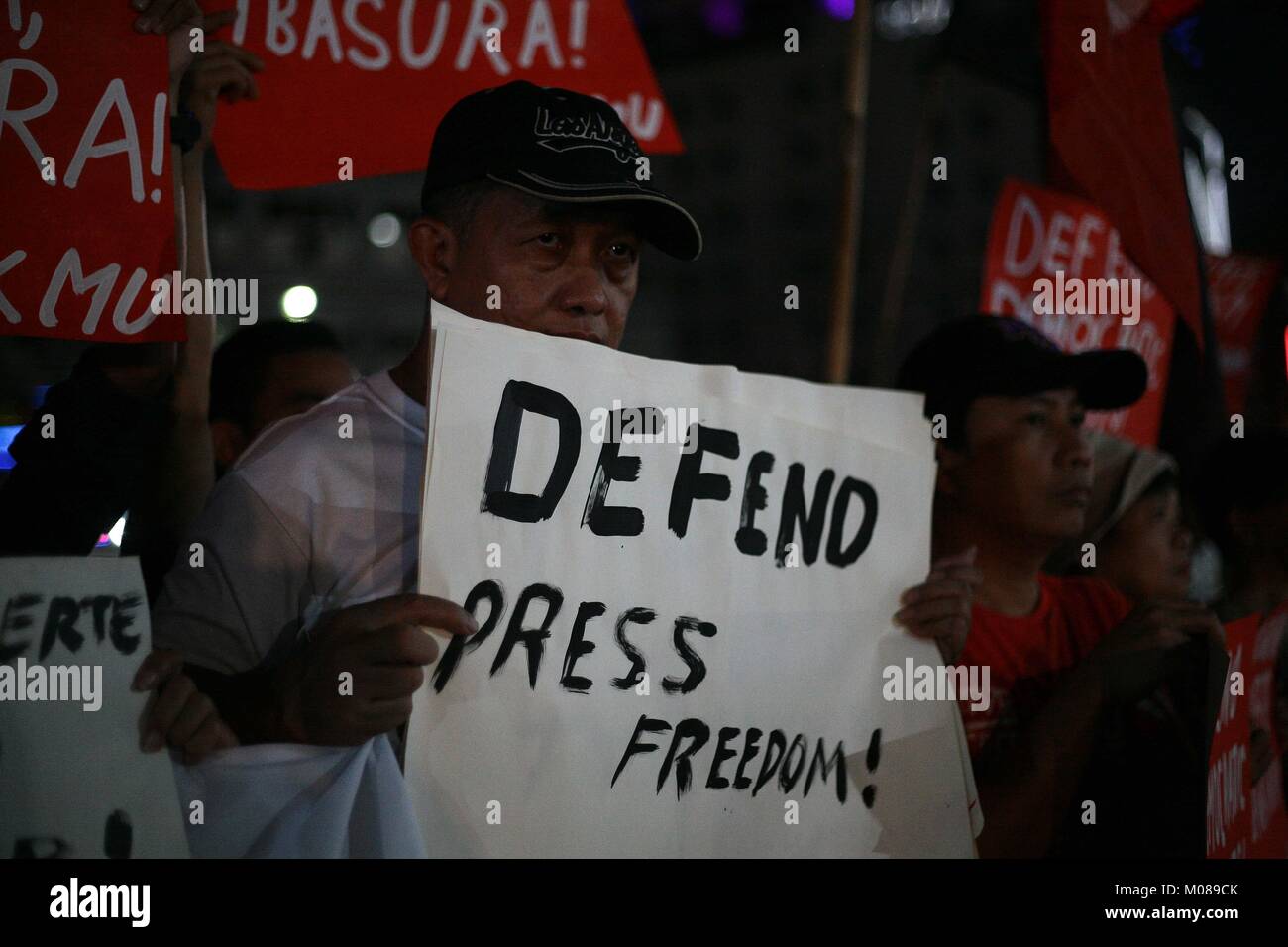 Manila, Philippines. 19th January, 2018. An activist holds a placard as ...