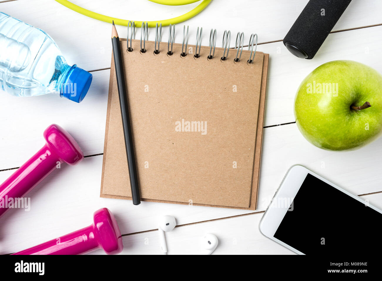 Fitness accessories on white wooden table Stock Photo - Alamy