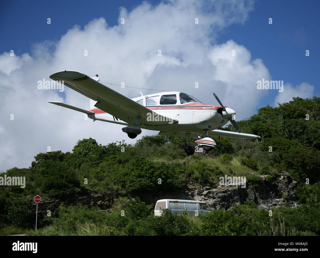 Piper Cherokee private aircraft landing at St. Barth's in the Caribbean ...
