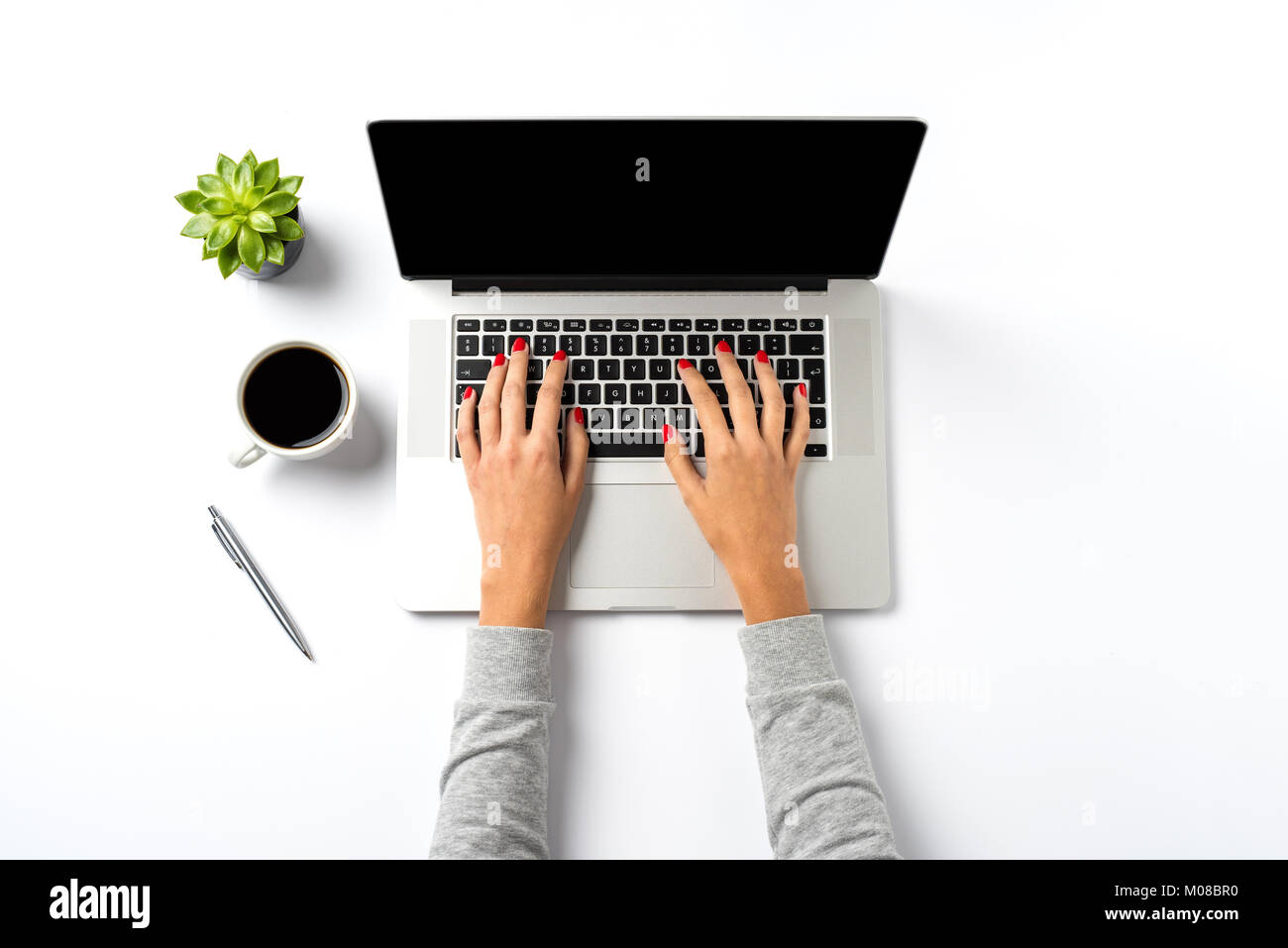 Female hands working on modern laptop. Office desktop on white ...
