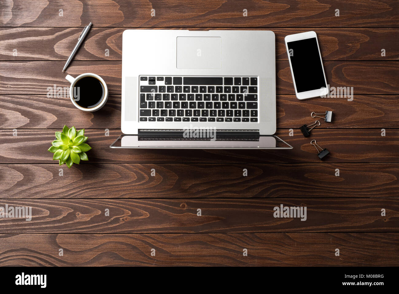 Overhead shot of wooden office desktop Stock Photo - Alamy
