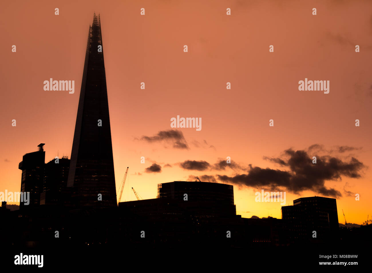 London skyline at sunset with silhoutted buildings Stock Photo - Alamy