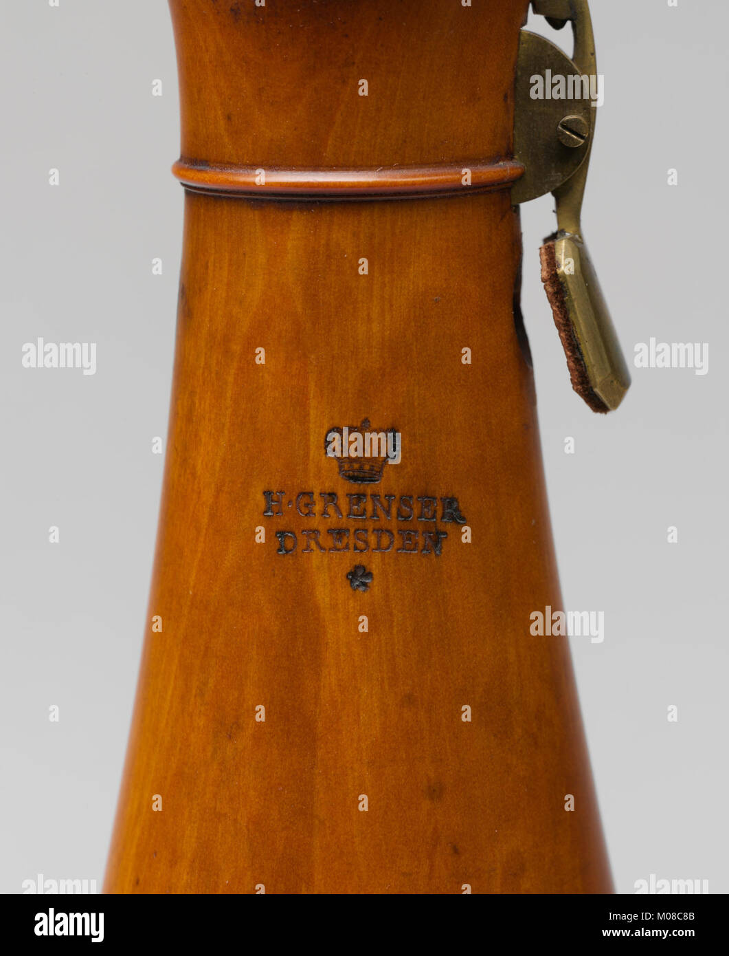 This image showcases an oboe, a woodwind instrument with a double reed ...