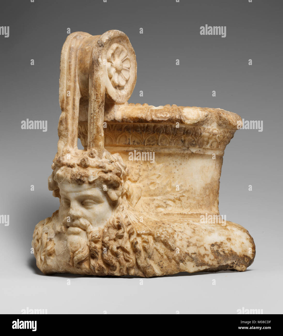 This marble fragment is part of a volute krater, an ancient Greek ...