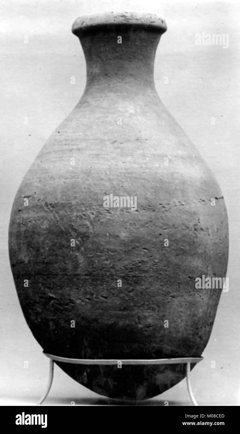 A large clay water jar serving as a functional and decorative vessel ...