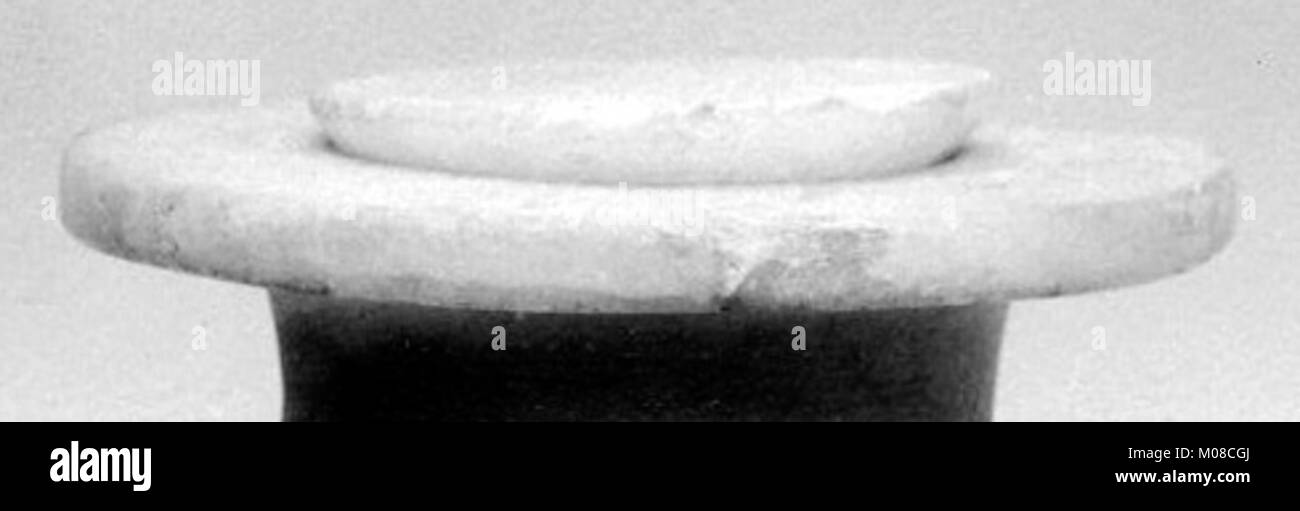 This jar lid, part of a historical ceramic vessel, reflects the design ...