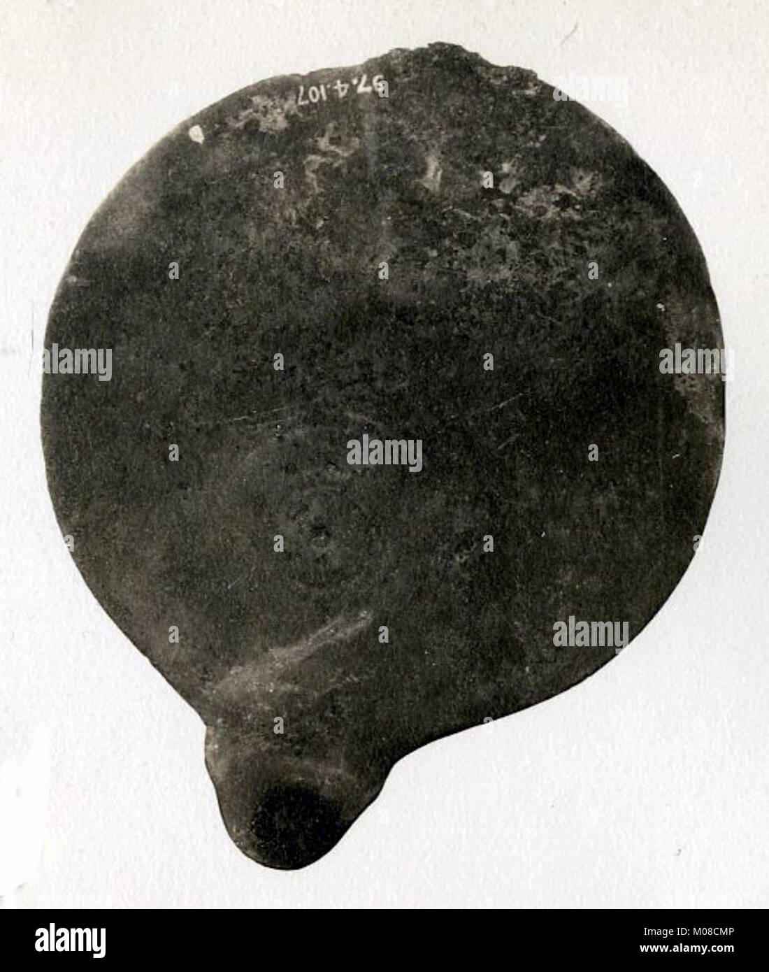 This mirror disk is a finely crafted object used for reflection and ...