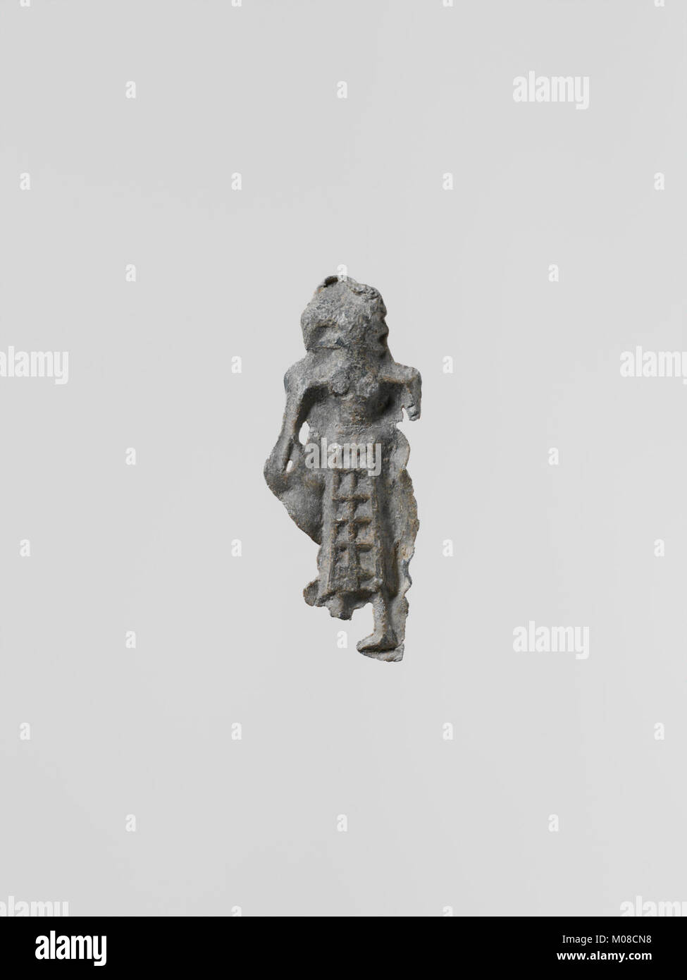 A lead figure of a woman, likely an ancient or historical ...