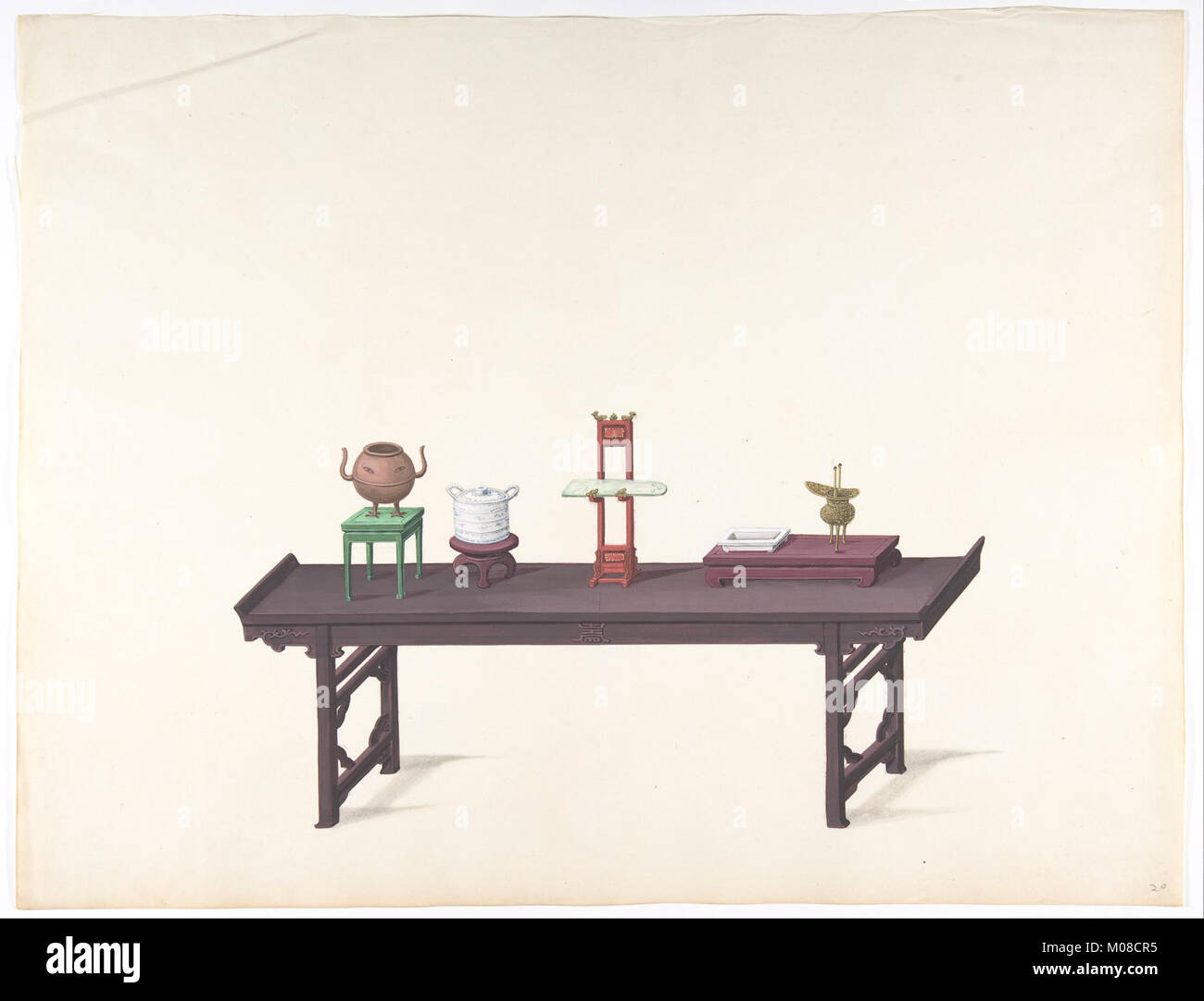 Purple lacquer long low table with decorative objects, reflecting ...