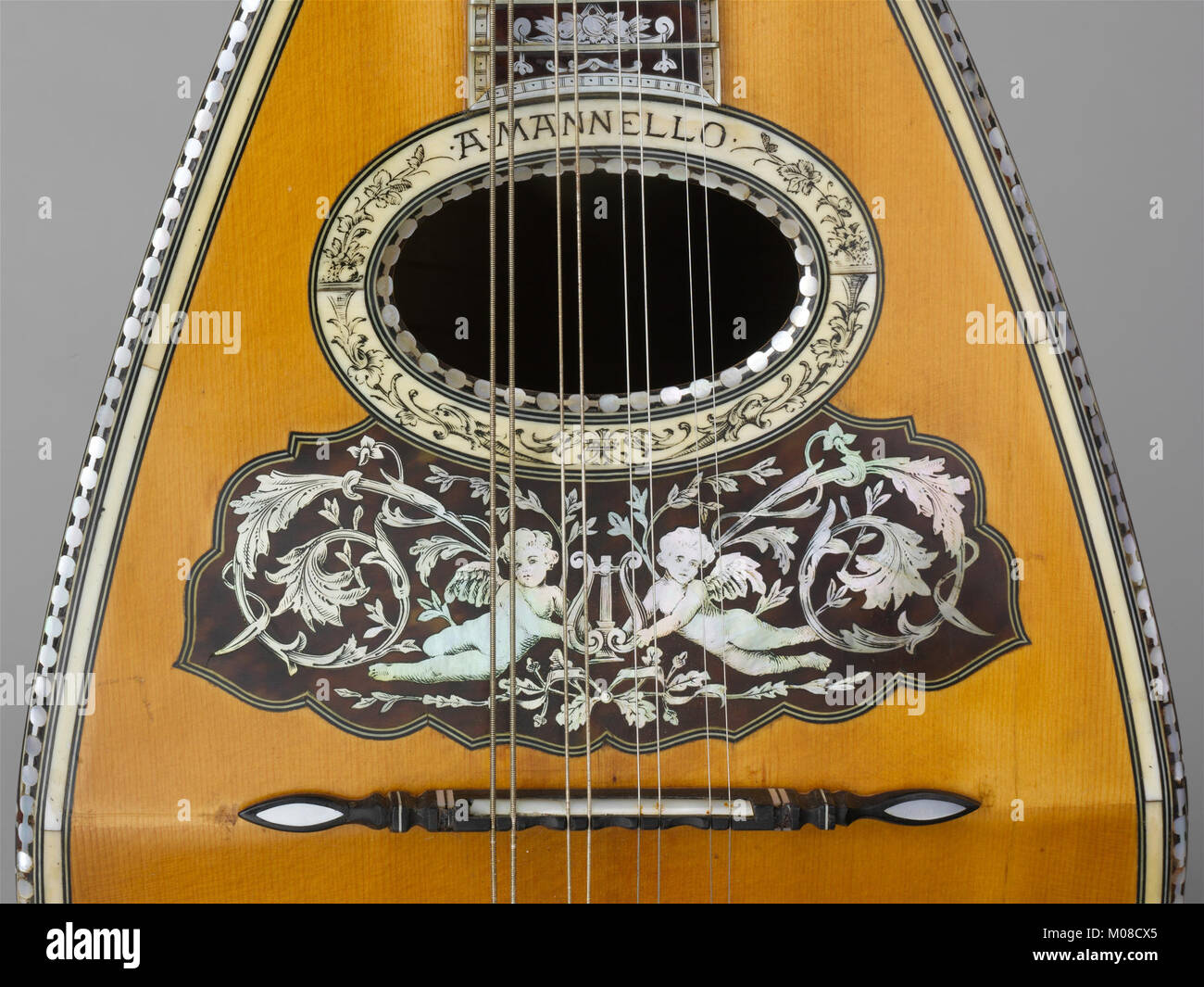 This mandolin is a stringed instrument from the 18th century, featuring ...