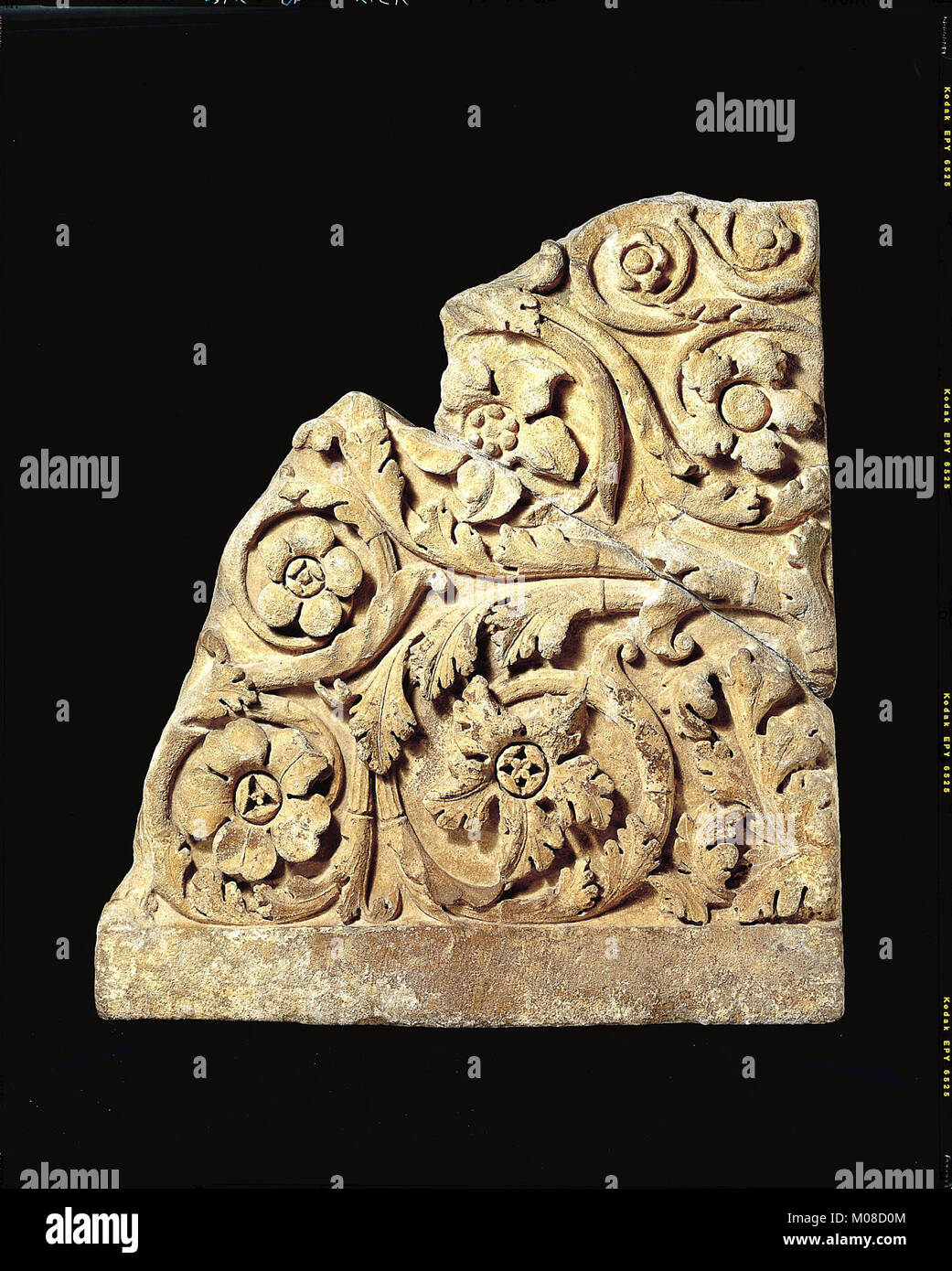 This marble acroterion features acanthus scroll motifs, a decorative ...