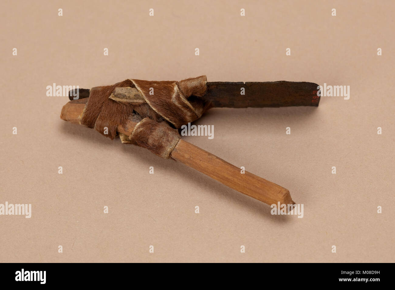 This model adze represents a tool used in ancient craftsmanship. It ...