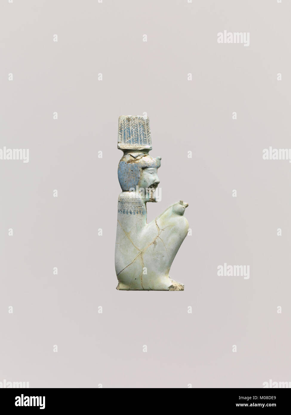 The inlay of Anhur (Onuris) shows a squatting Egyptian god, symbolizing ...