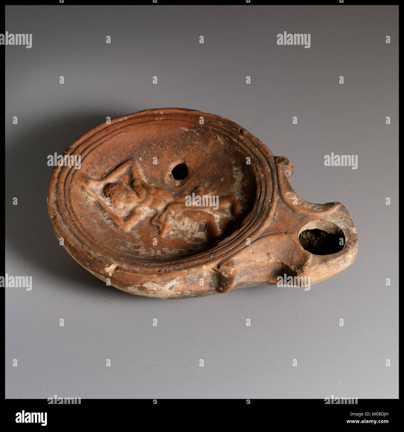 This historic lamp illustration, labeled MET DP135, represents an ...