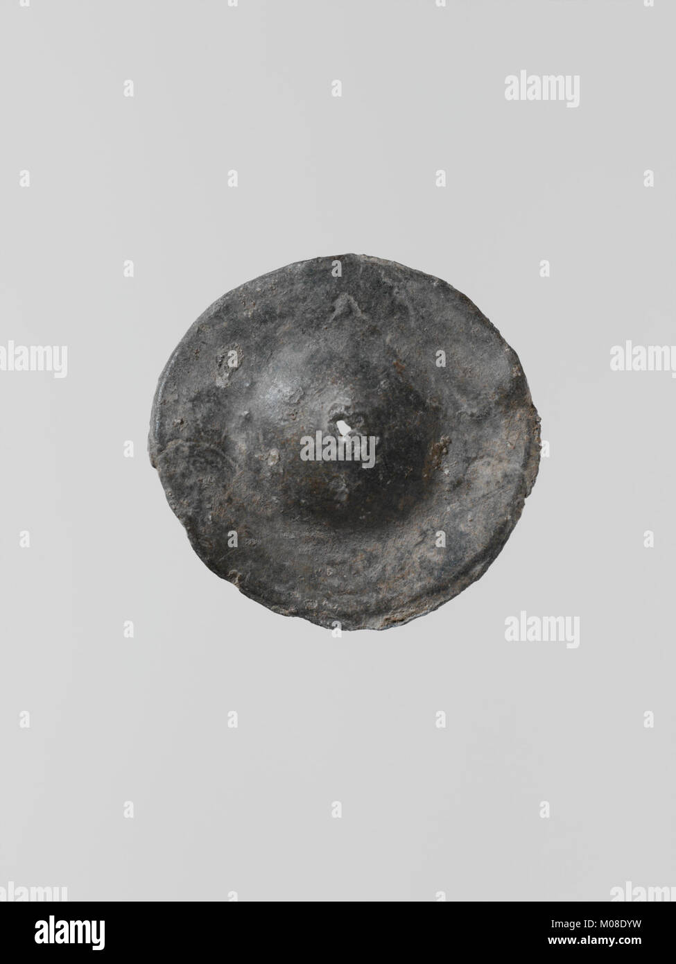 This lead disk features a hole in the center, indicating its possible ...