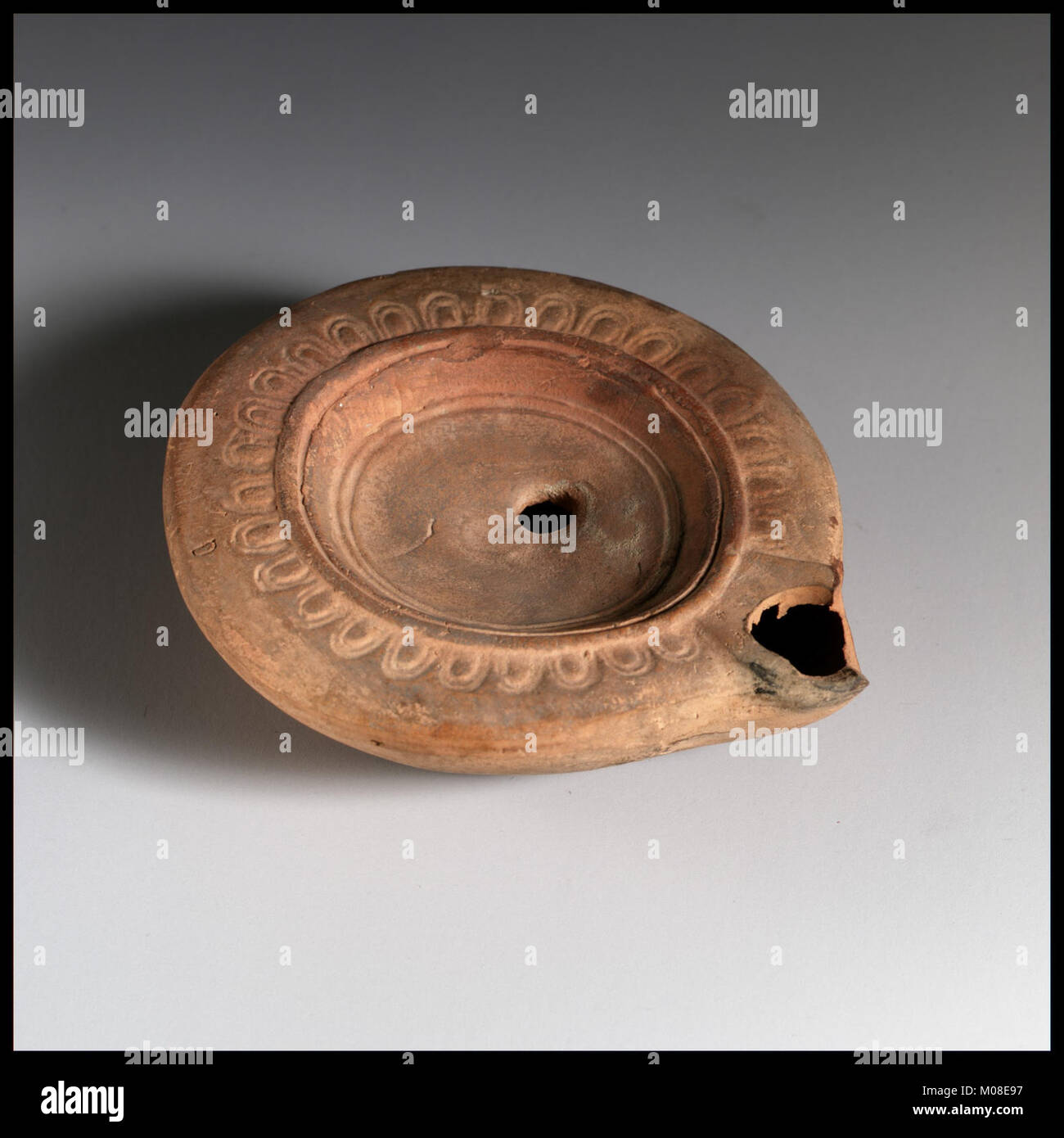 This lamp exemplifies historical lighting devices, showing design ...