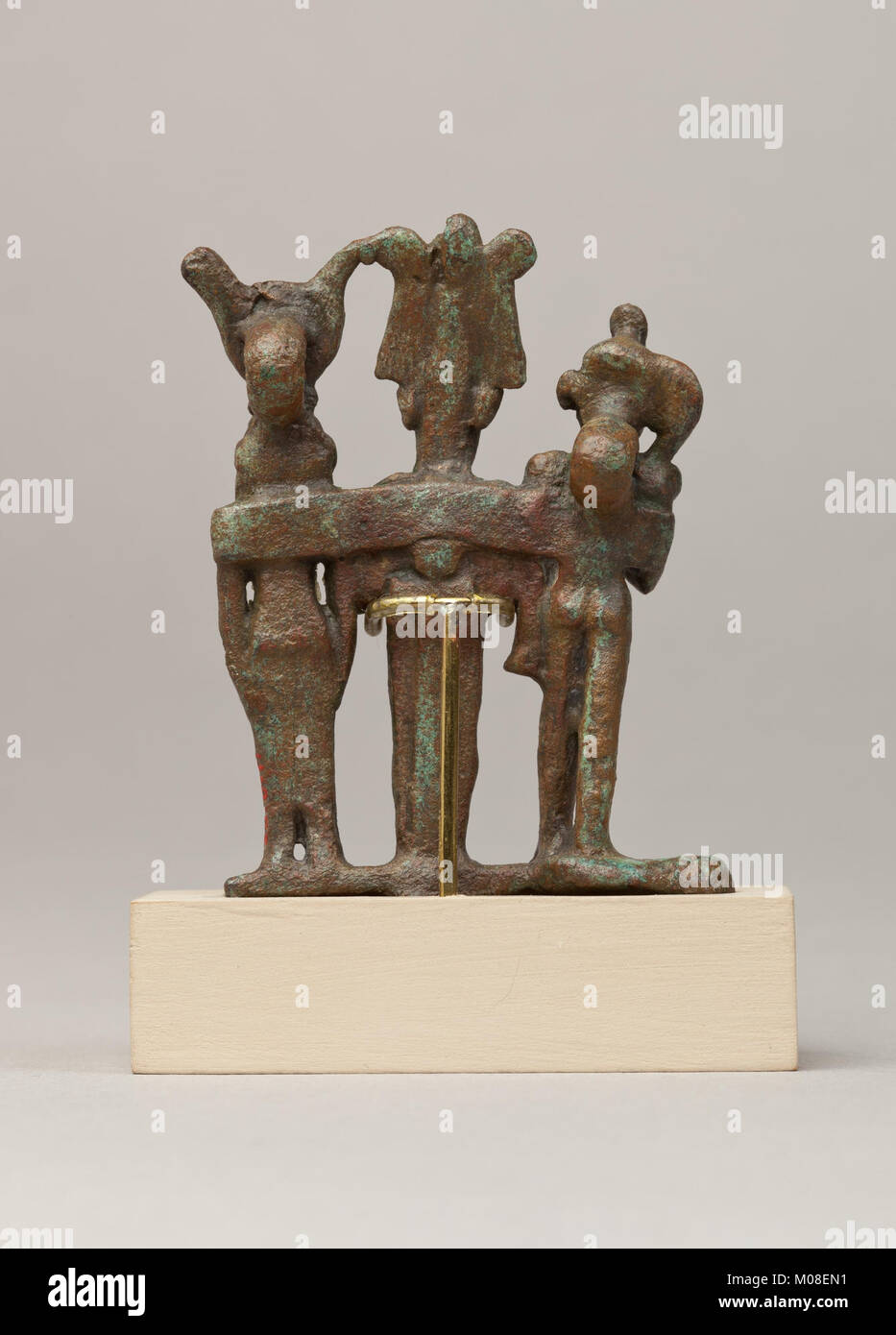 This Egyptian triad sculpture depicts Isis, Osiris, and Horus, key ...