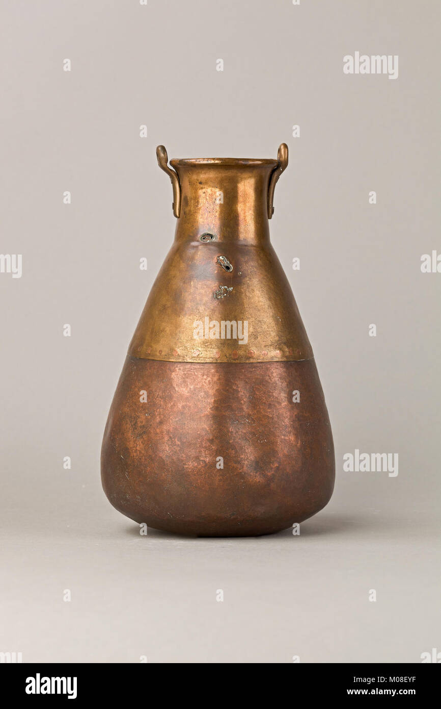 This metal jar demonstrates practical design and metalworking ...