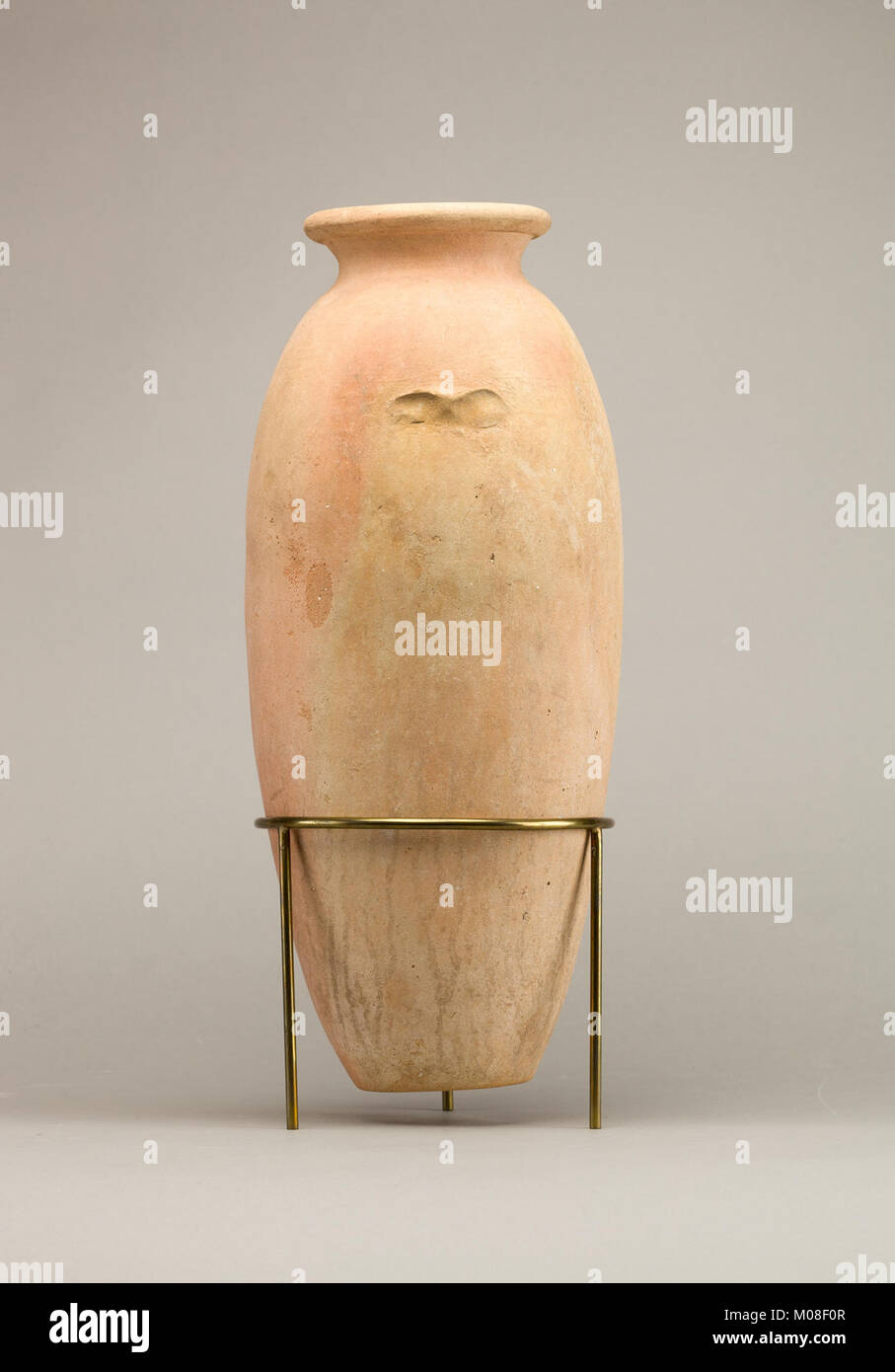 This large jar, featuring wavy handles, is a significant example of ...