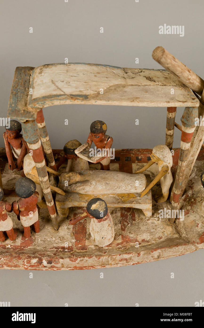 This model sailing boat, designed to transport a mummy, is an ancient ...