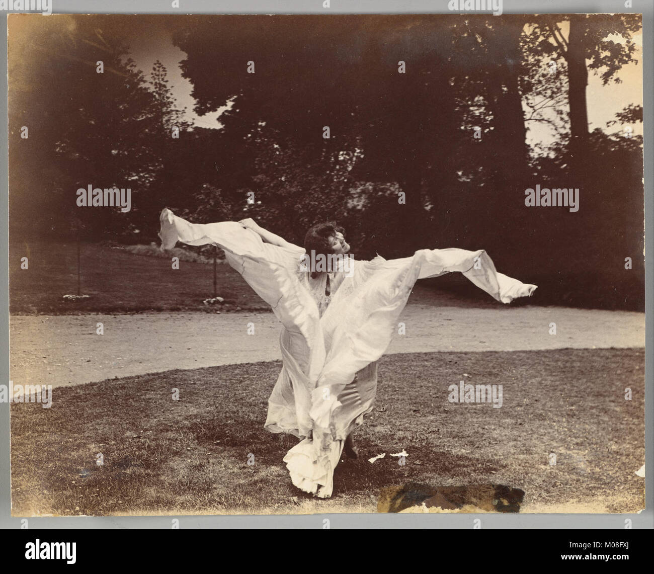 Loie Fuller, a pioneering dancer, is depicted in this artwork capturing ...