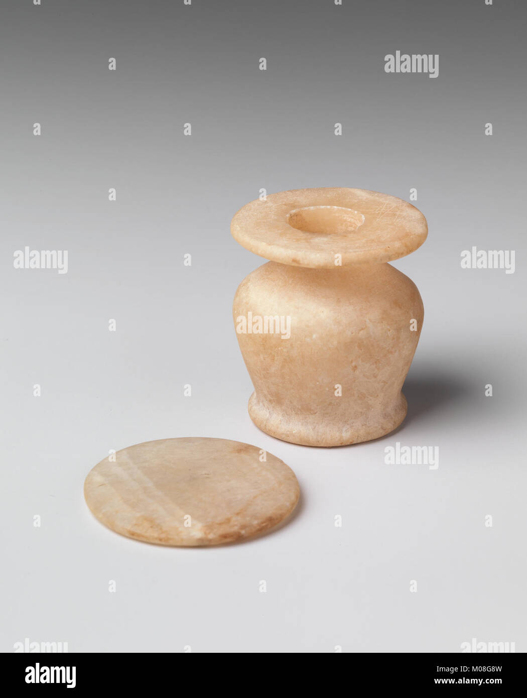 This kohl jar and its lid are artifacts representing personal care ...