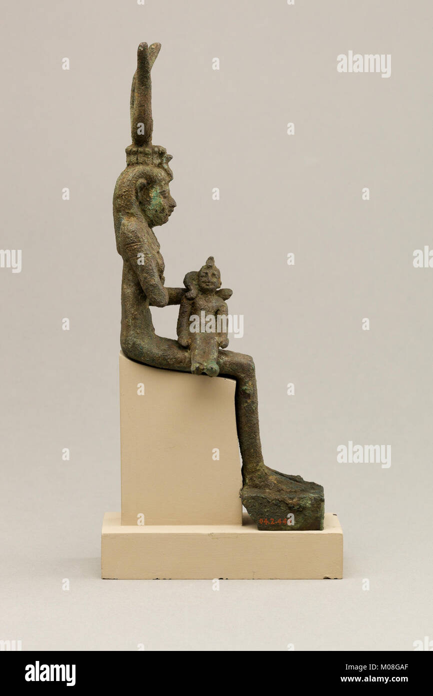 This artwork depicts the Egyptian goddess Isis with her son Horus. The ...