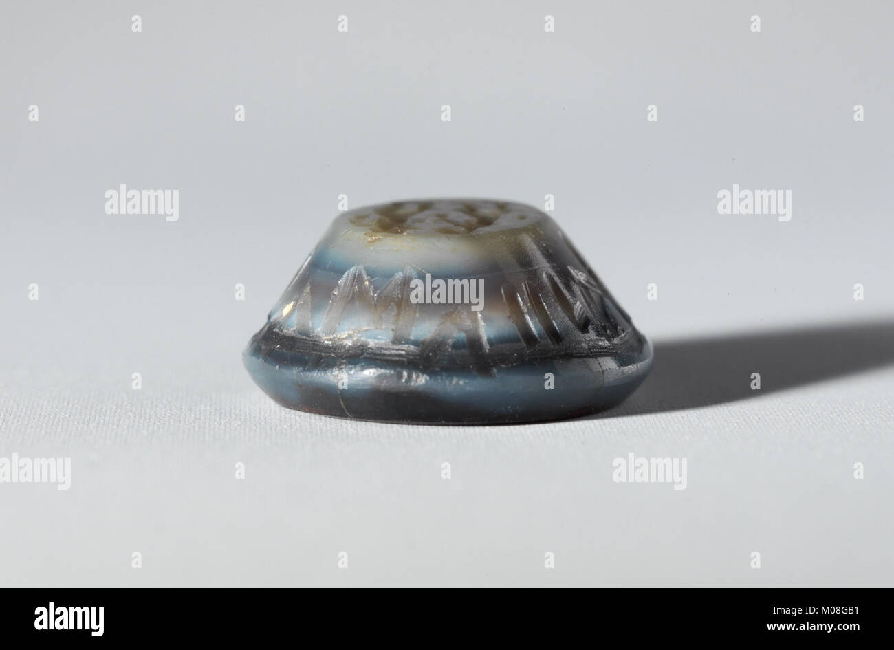 This intaglio depicts two standing figures, highlighting intricate ...