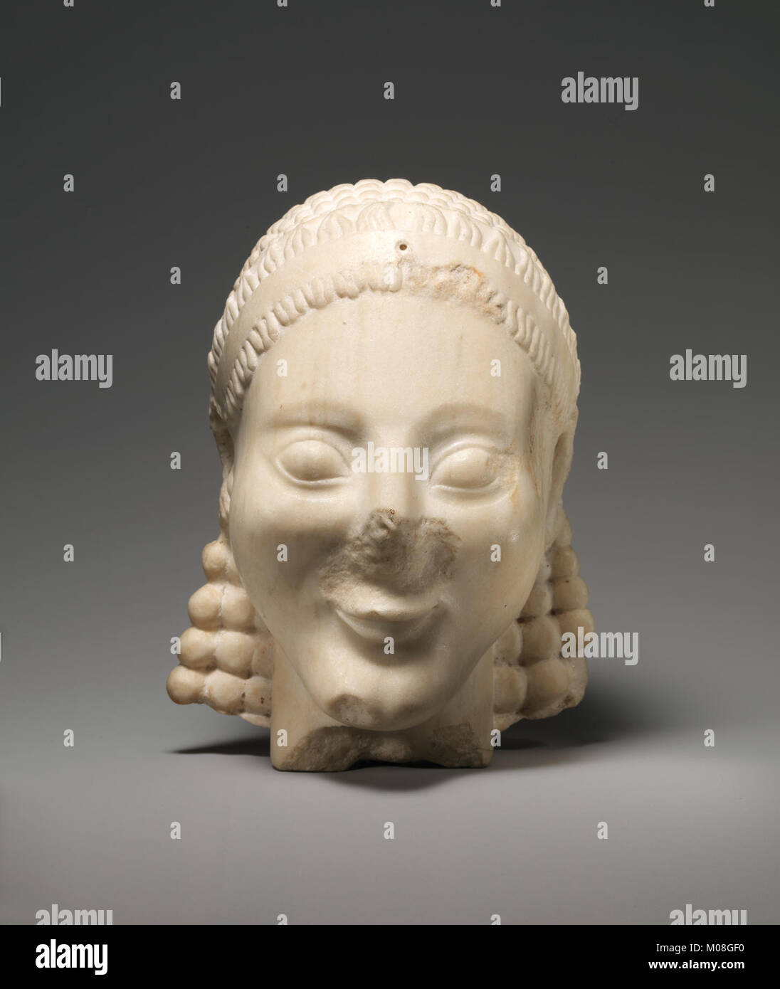This marble head of a kouros represents the idealized image of a ...