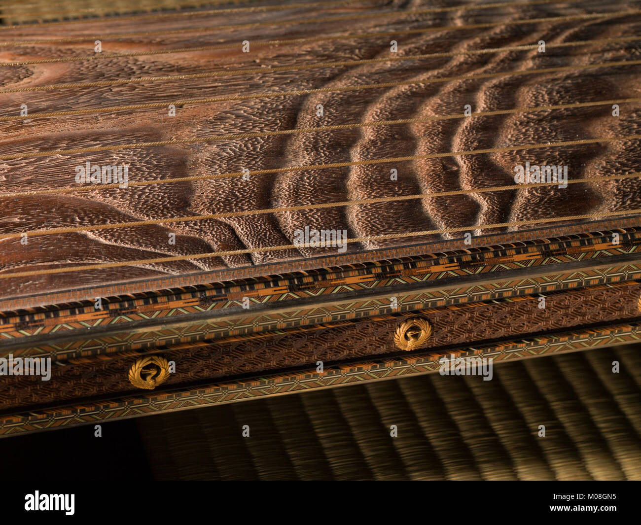 The Koto is a traditional Japanese stringed instrument, known for its ...