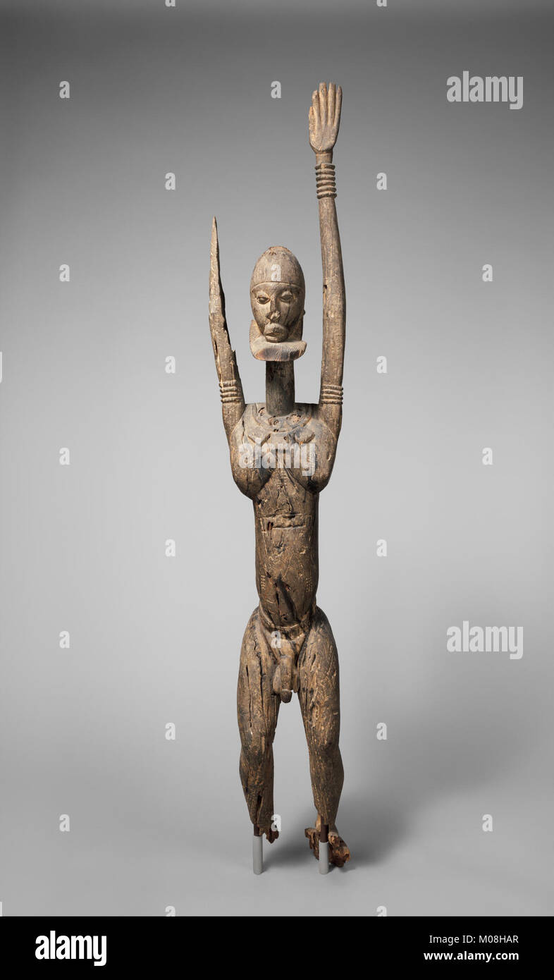 A sculpture of a male figure with raised arms, demonstrating strength ...