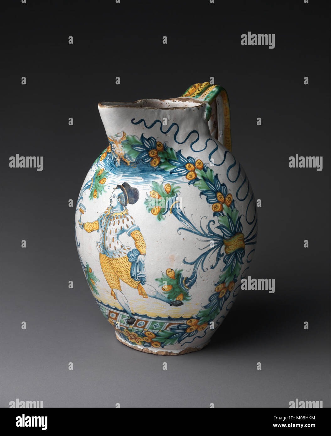 This jug is an example of ancient pottery, featuring detailed ...