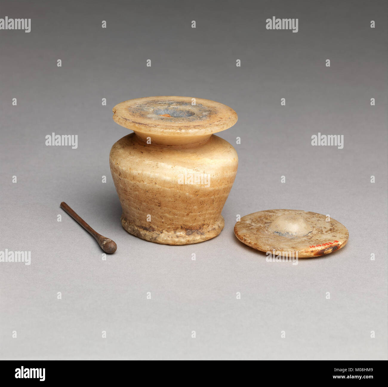 This kohl jar and stick, used for applying cosmetic eye makeup ...