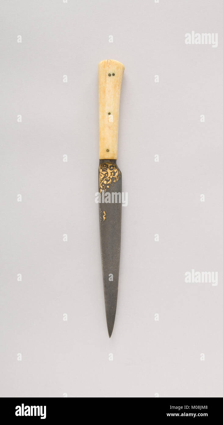 This Kard knife features a distinct curved blade, typical of Persian ...