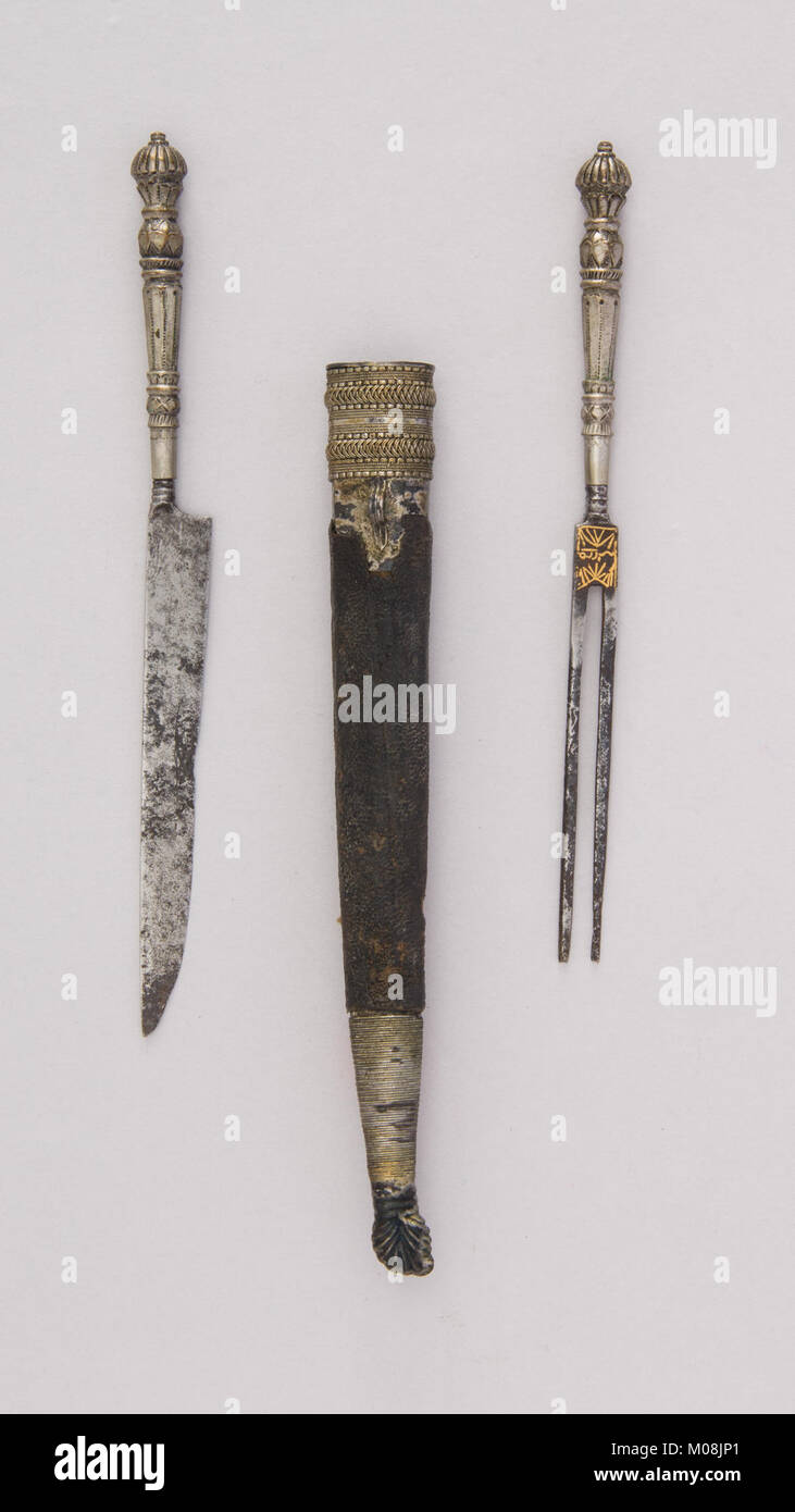 A knife and fork set with sheath, demonstrating intricate design and ...